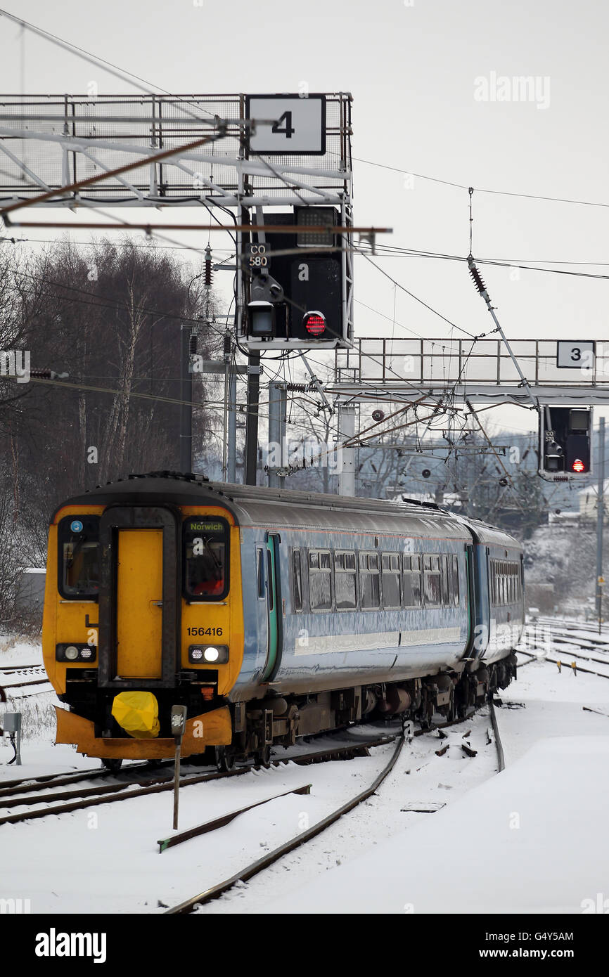 A train arrives at Norwich station, Norfolk, after heavy overnight snow ...