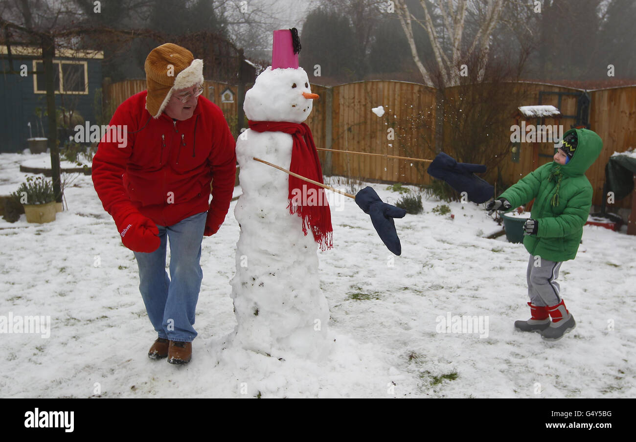 Graham Thompson plays in the snow with his grandson William, at his ...