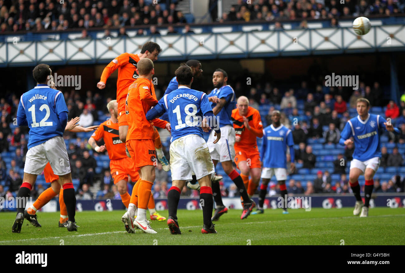 Dundee United's Gavin Gunning rises highest to score their first goal ...