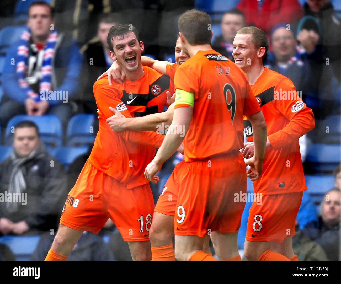 Dundee United's Gavin Gunning (left) celebrates scoring during the ...