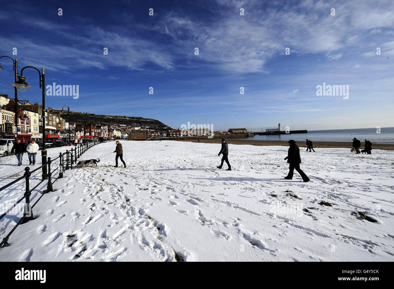 Walking on the beach at Scarborough, Yorkshire, following heavy snow ...