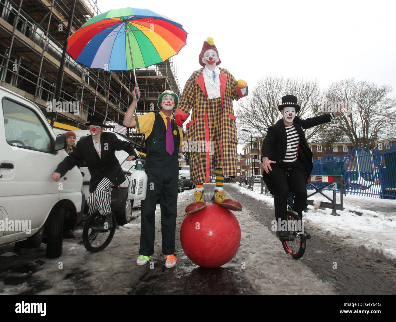 Clowns wearing full costume arrive holy trinity church in dalston hi ...