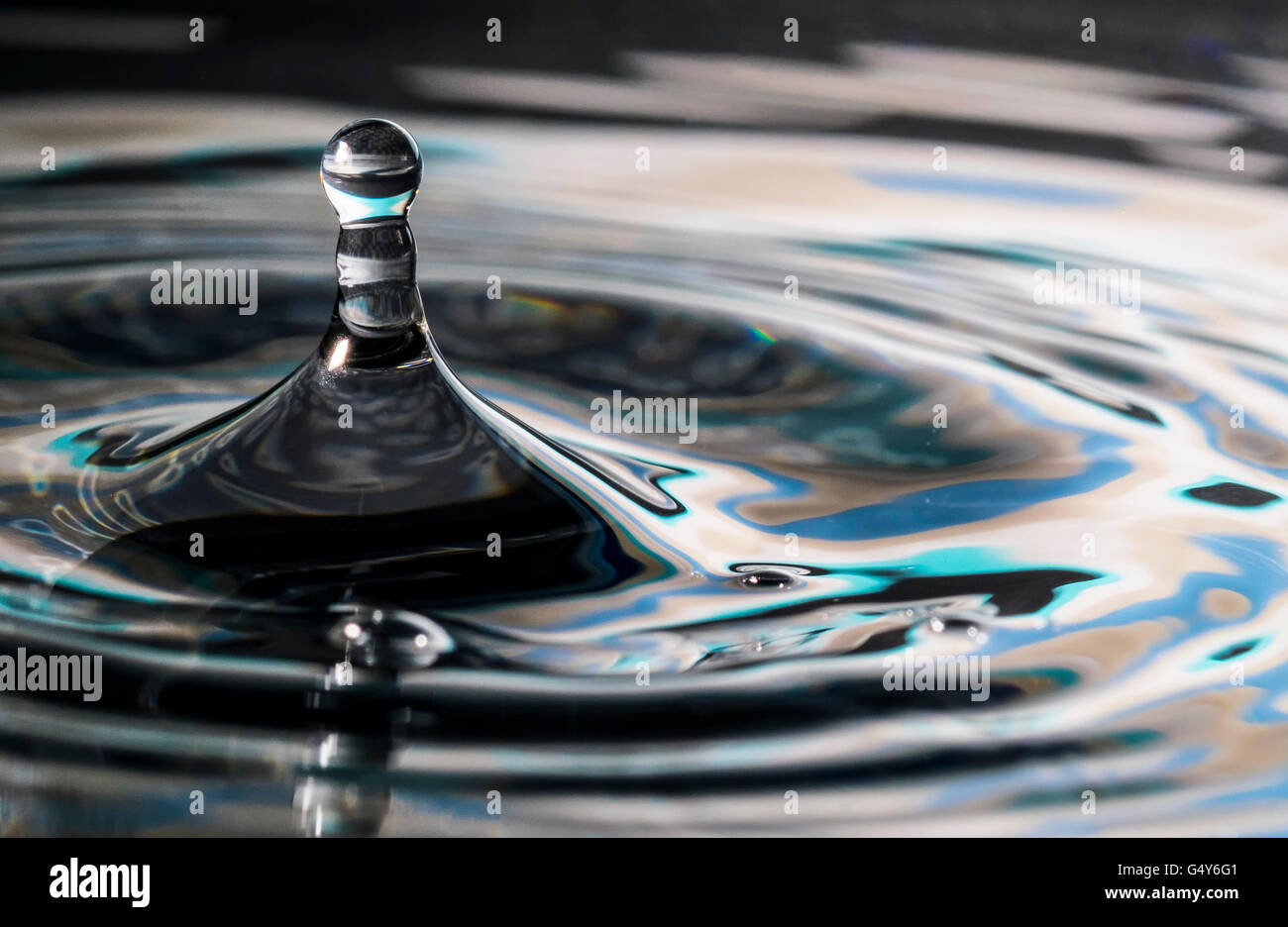 Water drop in the shape of a chess pawn with turquoise blue rippled ...