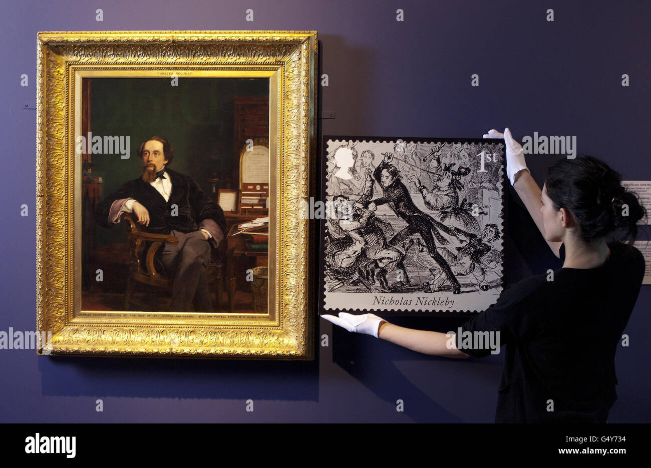 Caroline Stephenson holds an enlarged stamp of Nicholas Nickleby, from ...