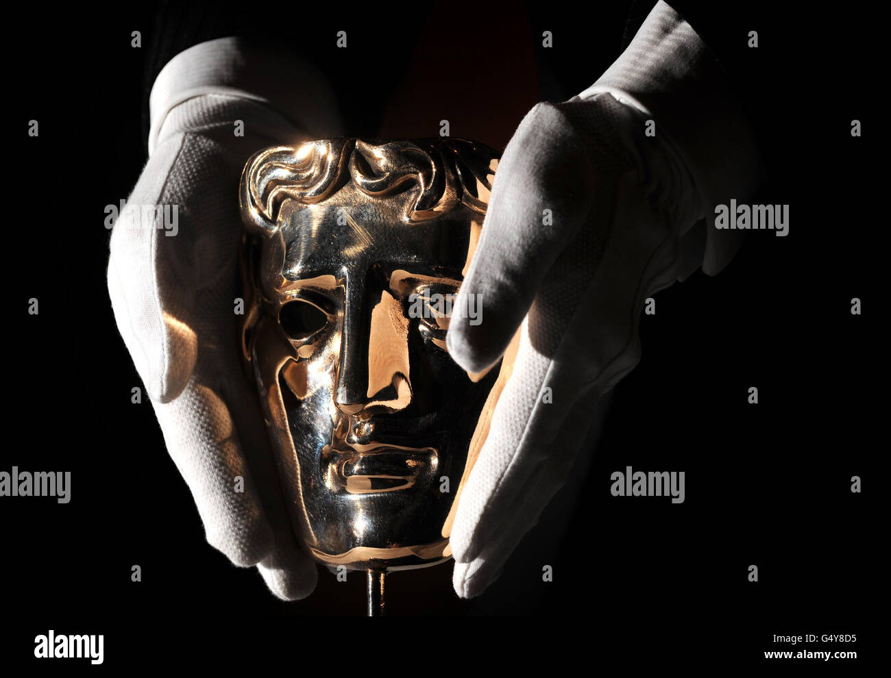 A British Academy of Film and Television Arts - BAFTA award mask is ...