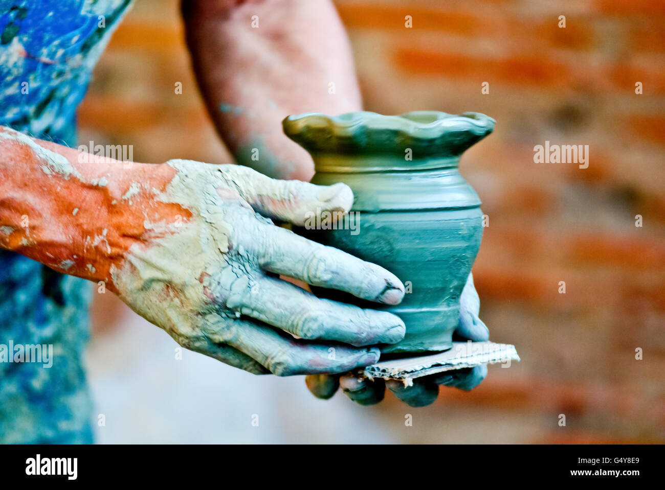 hands working in clay to create crafts and artistic clay pots Stock ...