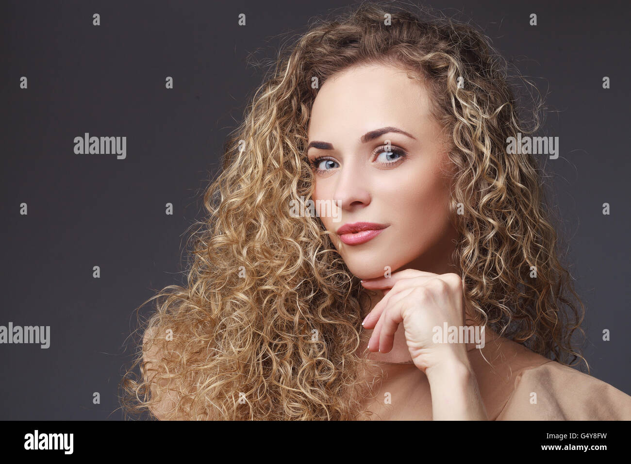 Portrait of perfect woman with curly hair Stock Photo - Alamy