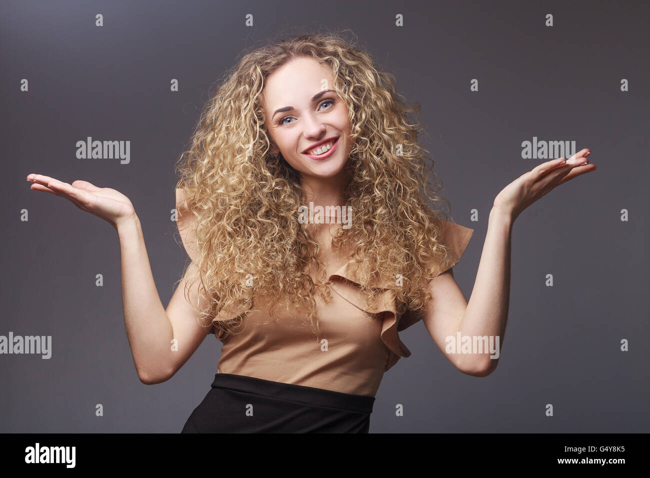 Portrait of perfect woman with curly hair Stock Photo - Alamy