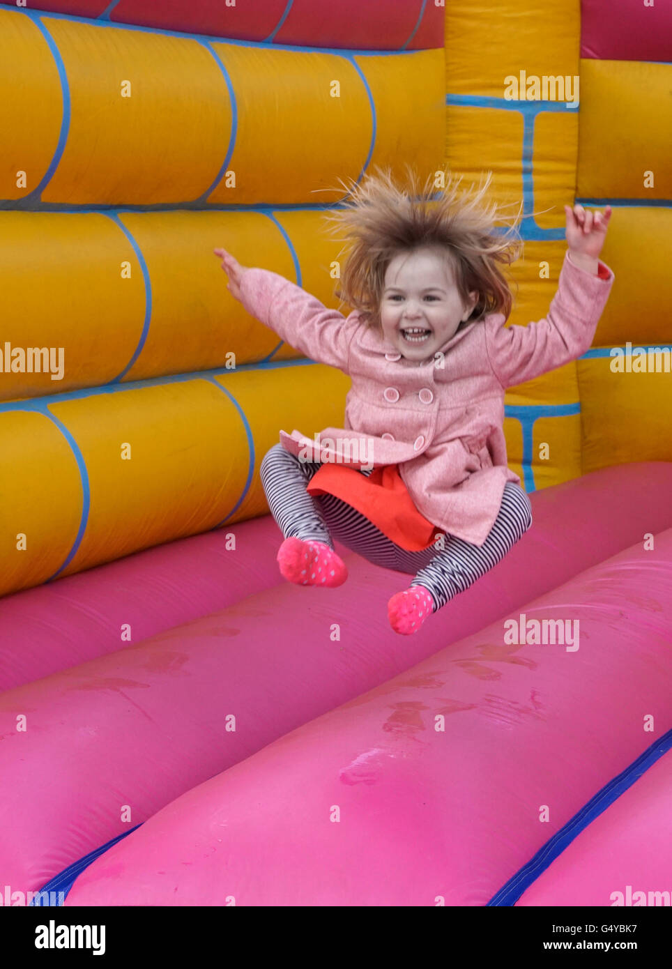 toddler jumping on inflatable Stock Photo - Alamy