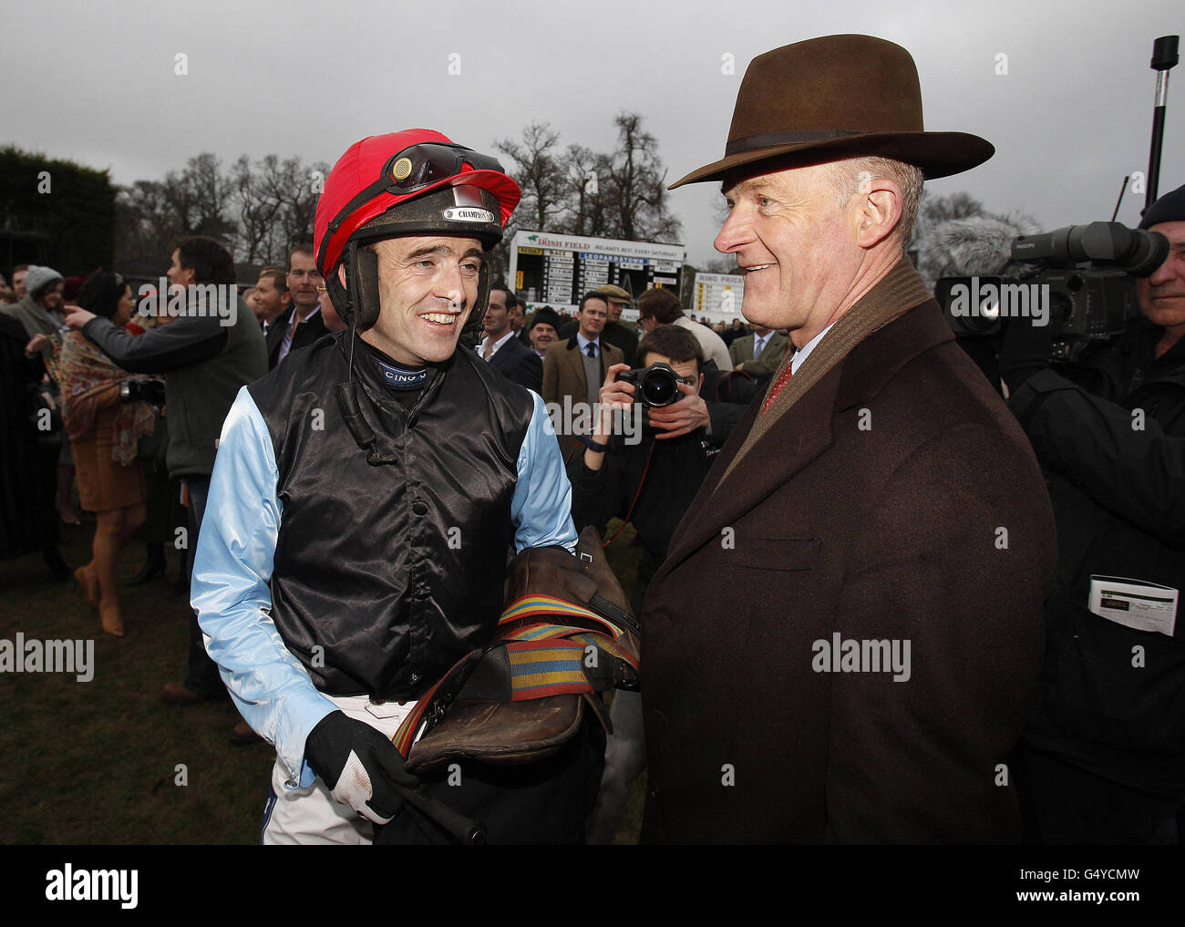 Ruby Walsh with trainer Willie Mullins after winning with Quel Esprit ...