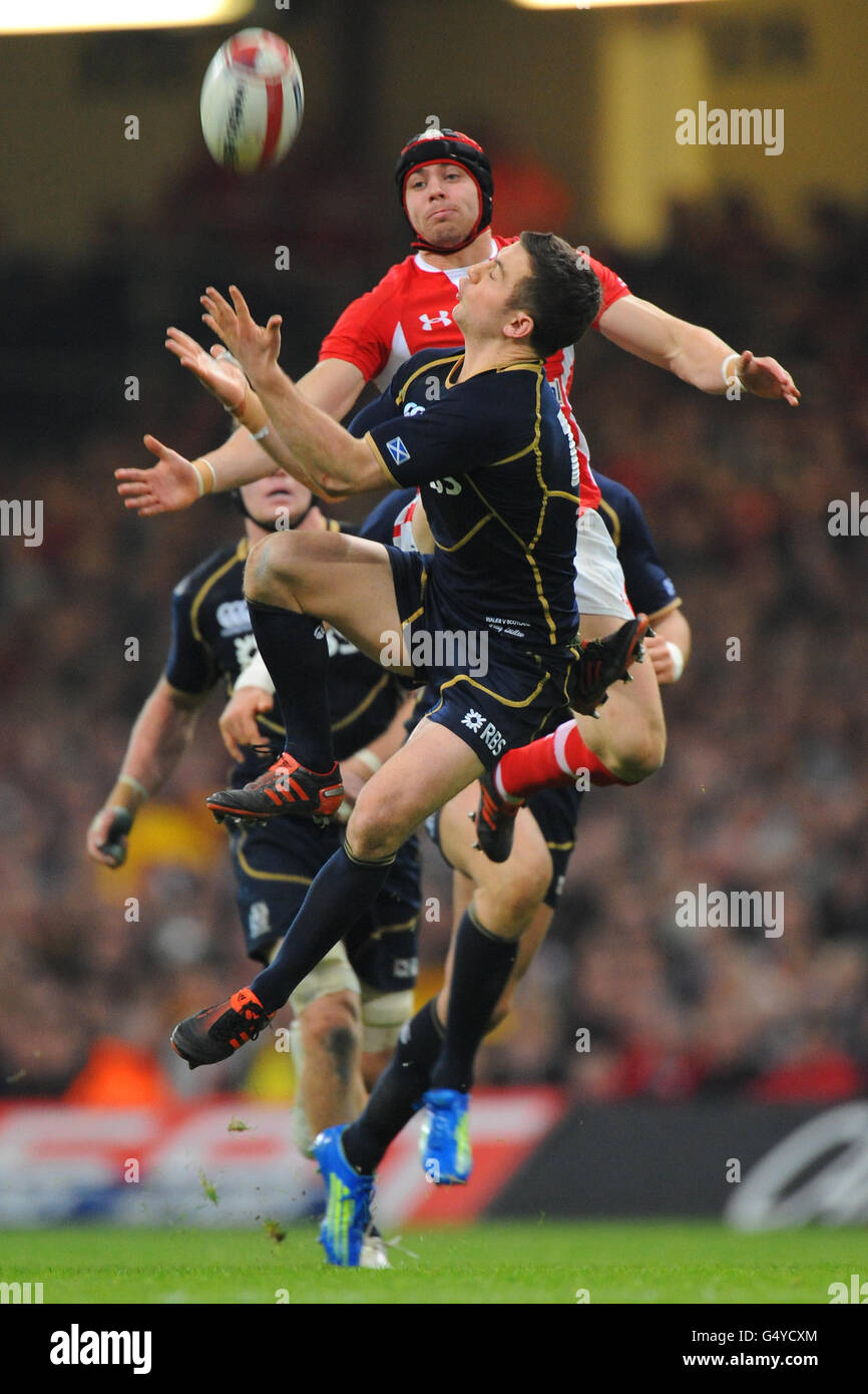 Wales' Leigh Halfpenny and Scotland's Greig Laidlaw compete for a high ...