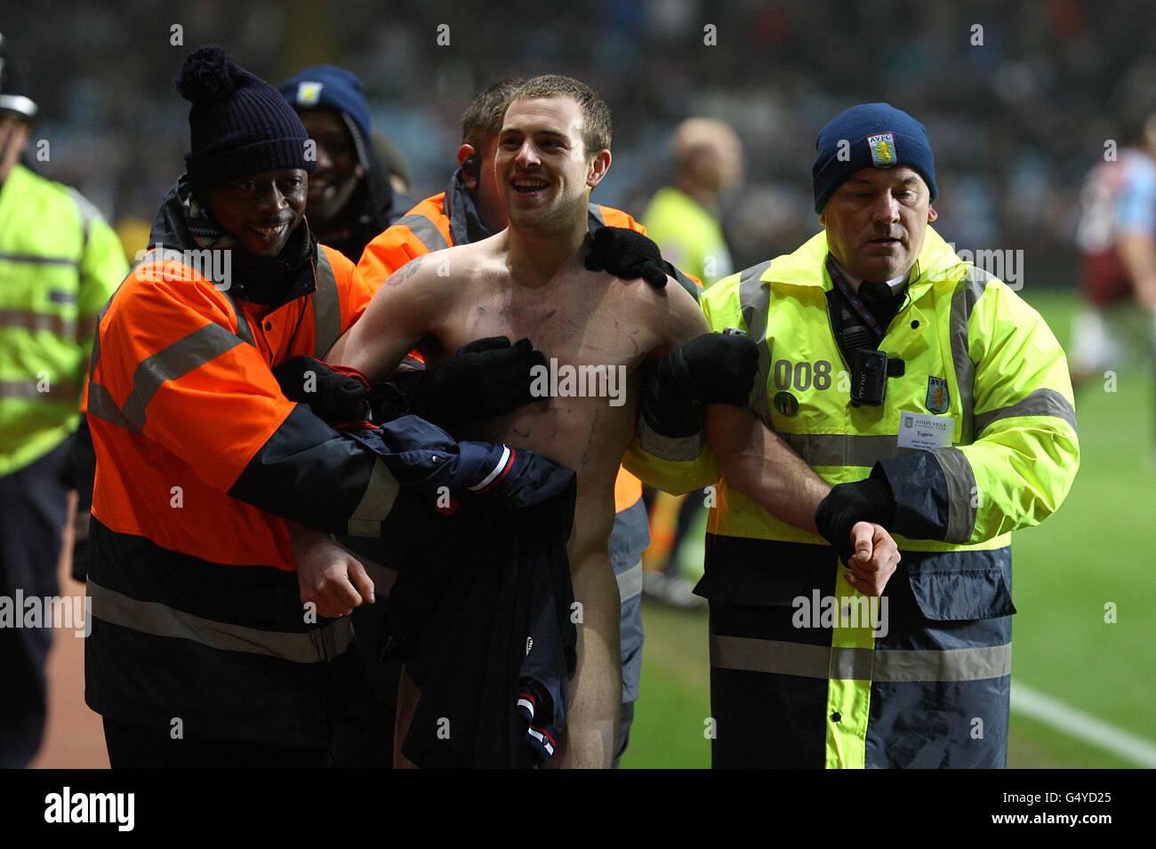 A streaker is led away by stewards hi-res stock photography and images ...
