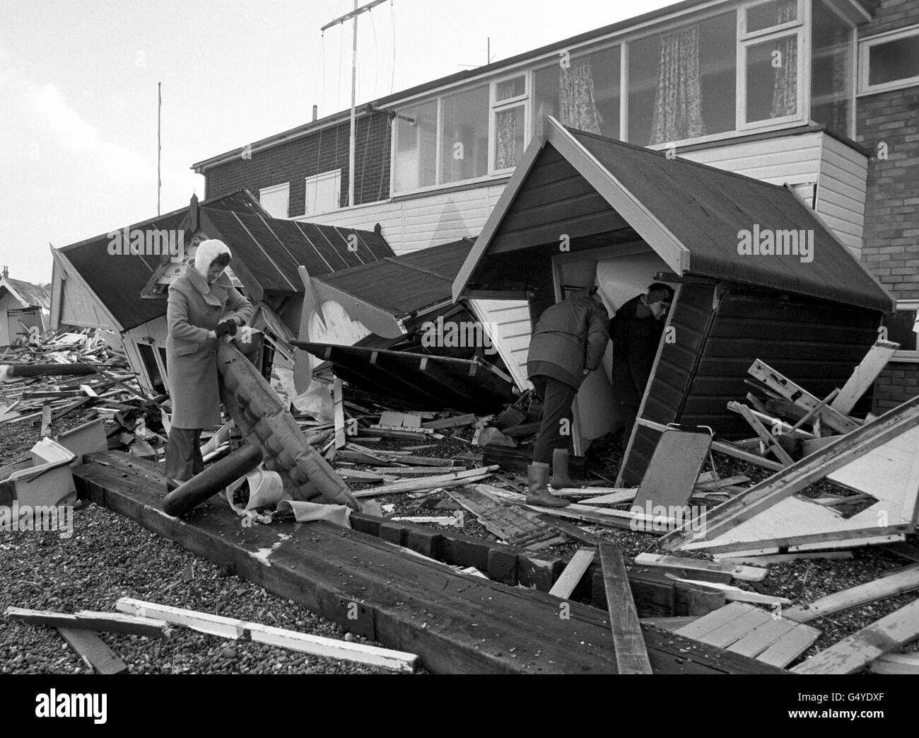 People salvaging what they can from their beach huts at Herne Bay ...