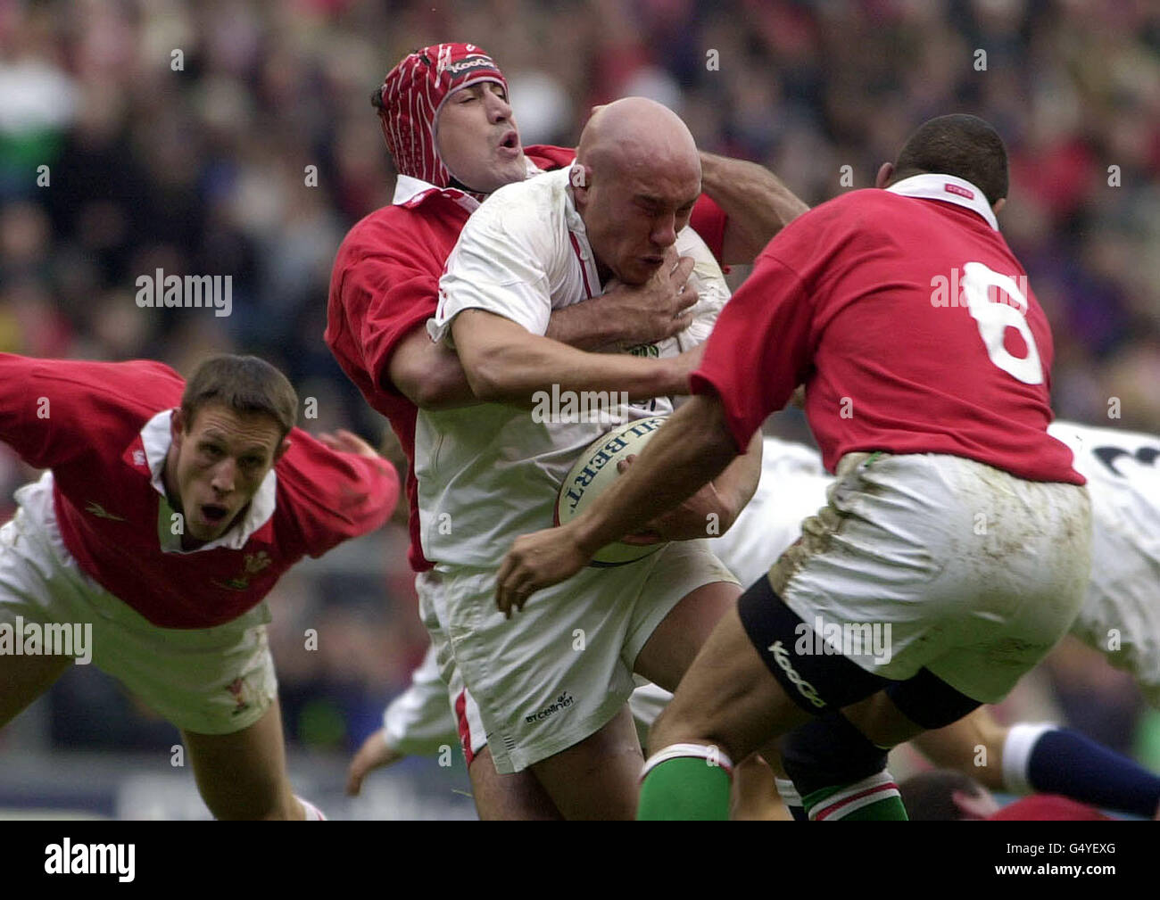 England's Phil Greening is stopped in his tracks by Wales' Chris Wyatt ...