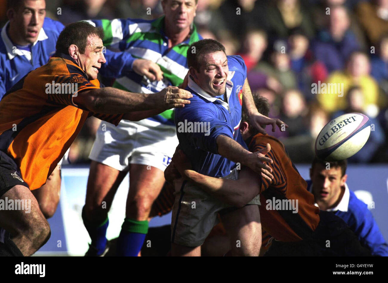 Scotland's Stuart Reid holds off France's Gerald Merceron during the ...