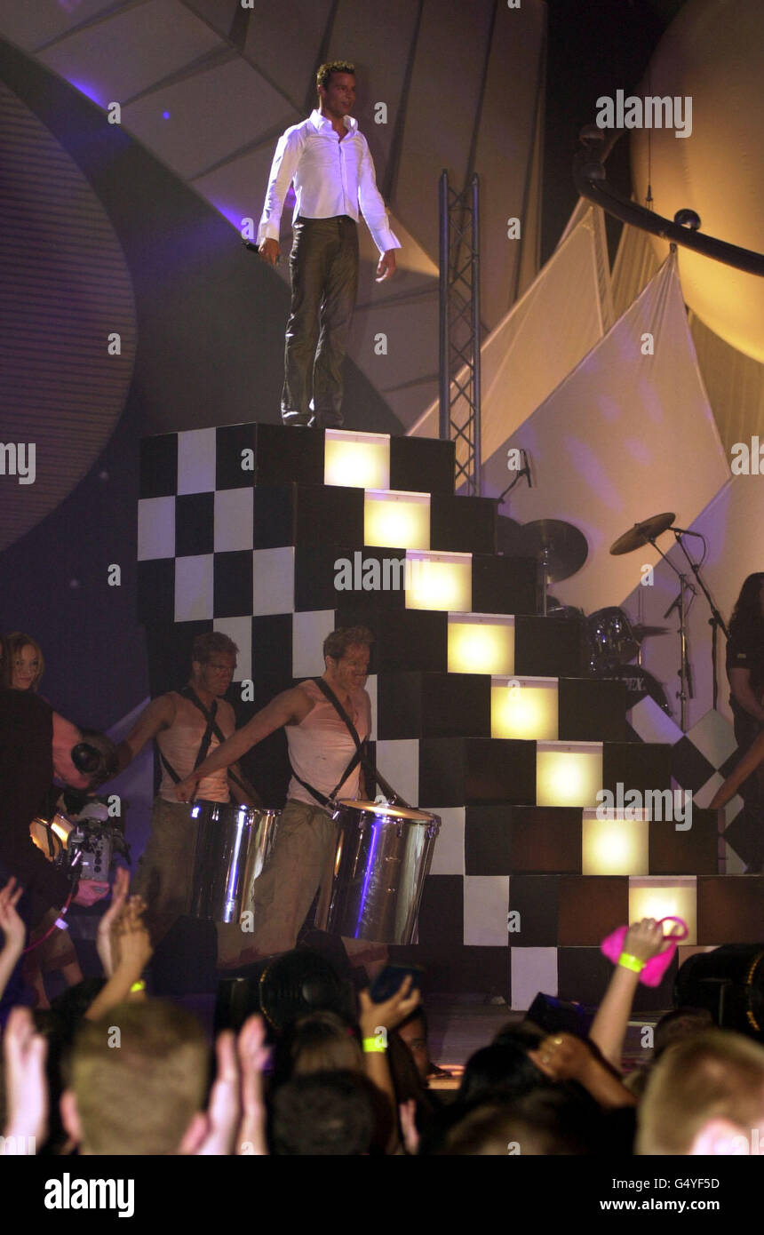 Latin pop singer Ricky Martin makes his entrance before performing on ...