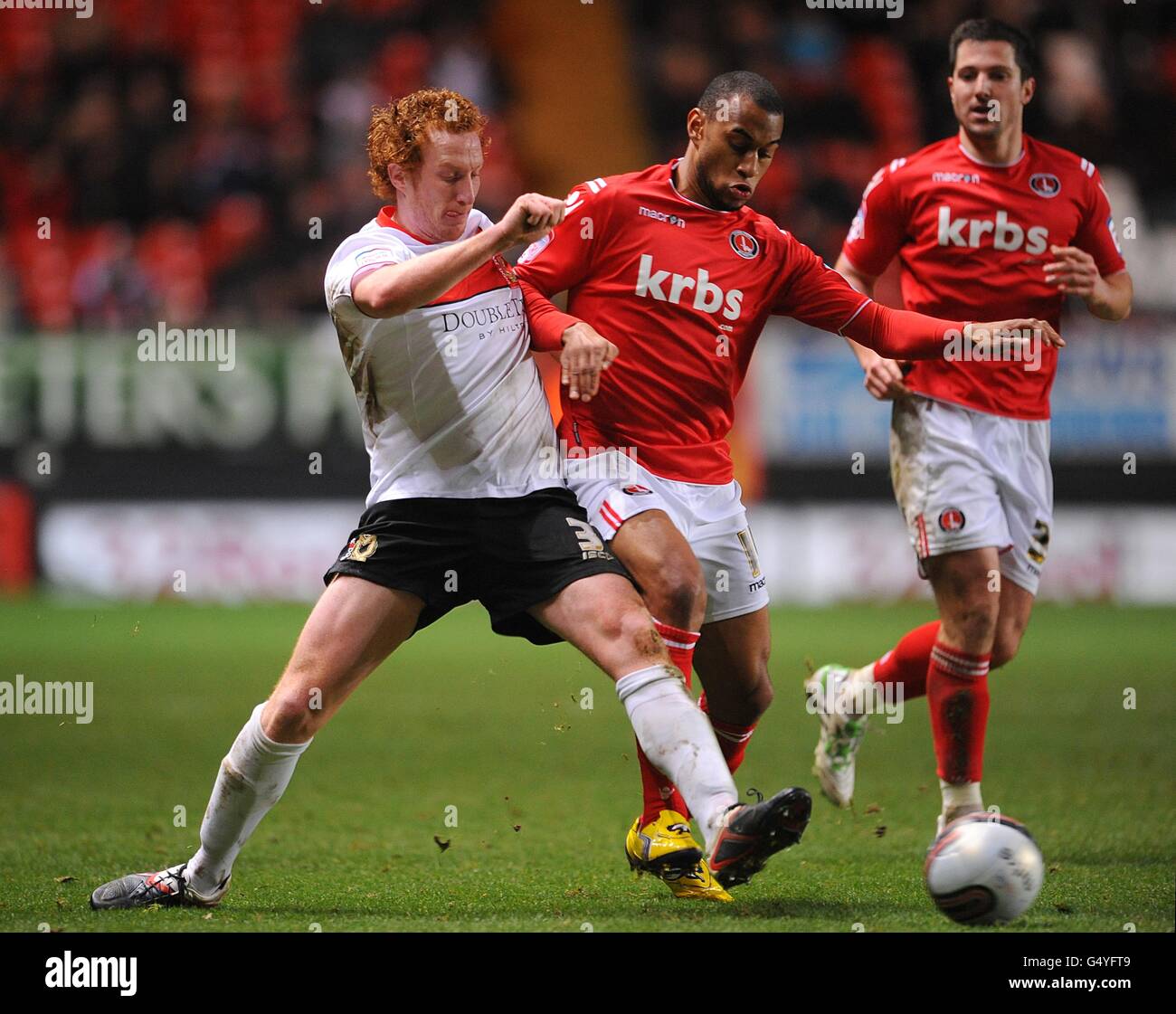 Charlton Athletic's Danny Haynes (centre) and Milton Keynes Dons' Dean ...