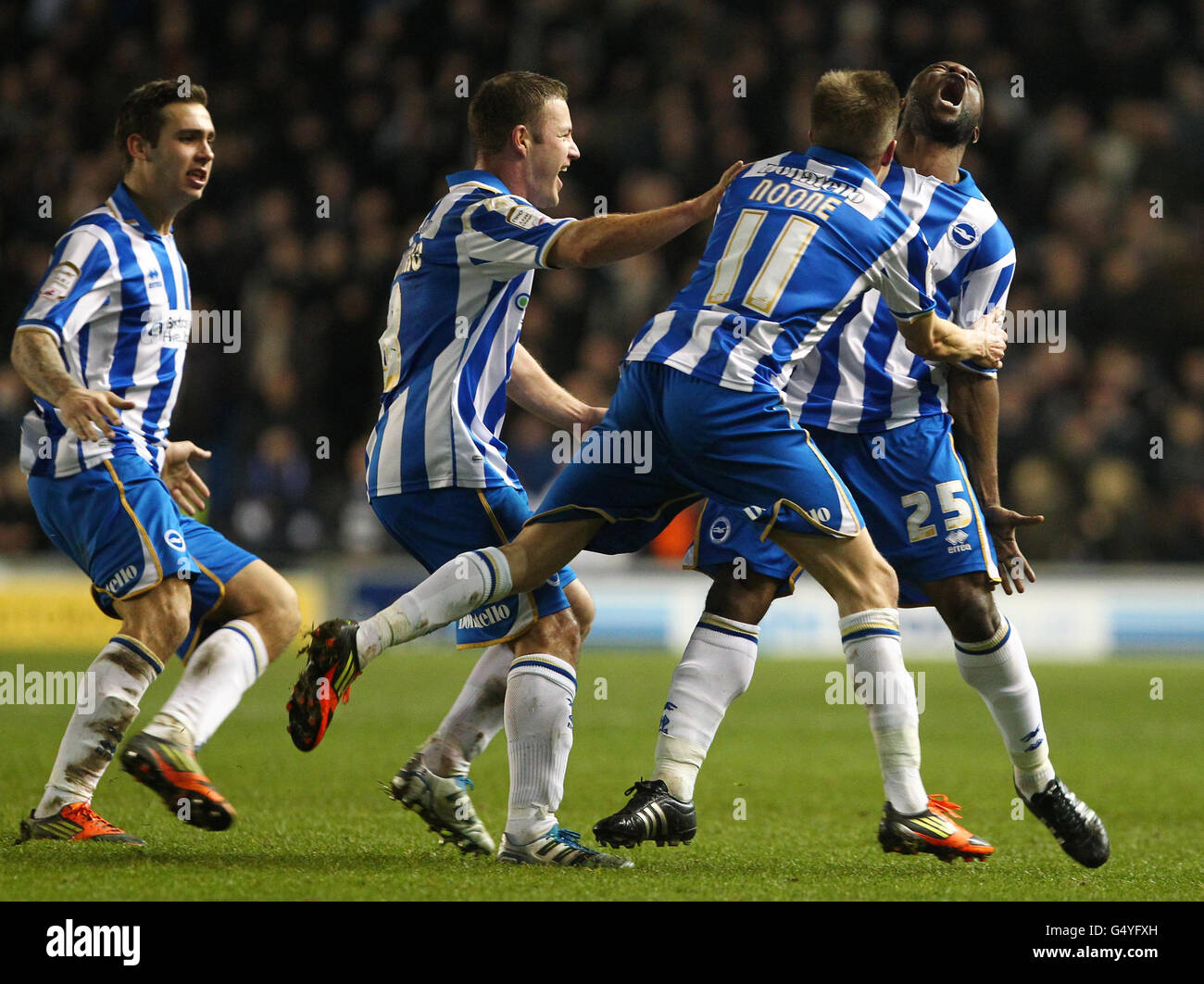 Brighton's Kazenga Lua Lua (right) is moobed by team mates as he ...