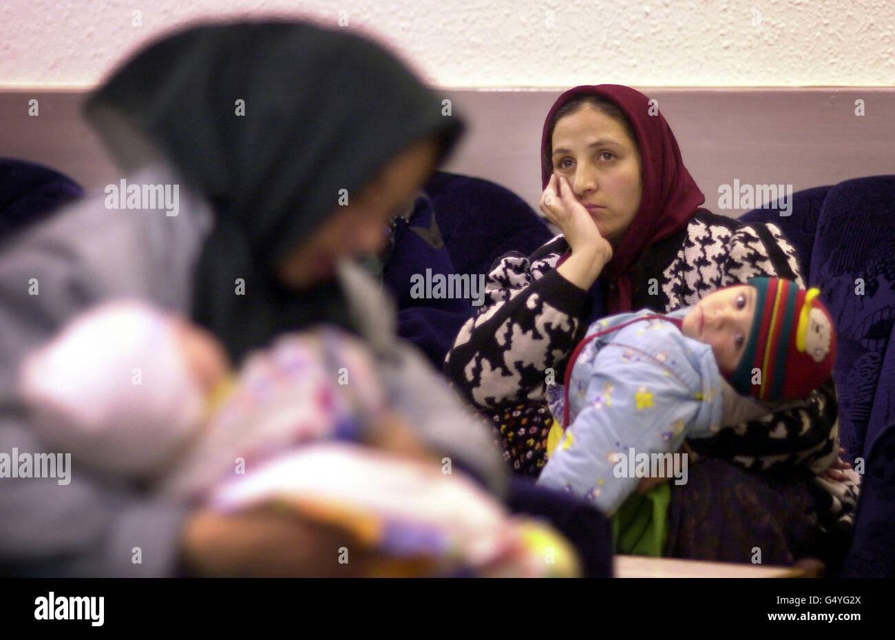 Romanian refugees weary from the overnight drive up from London and the ...