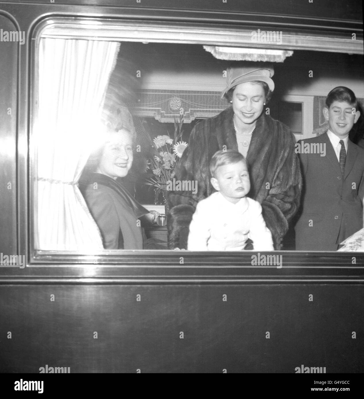 The Queen Mother, Queen Elizabeth II, holding her baby son, Prince ...