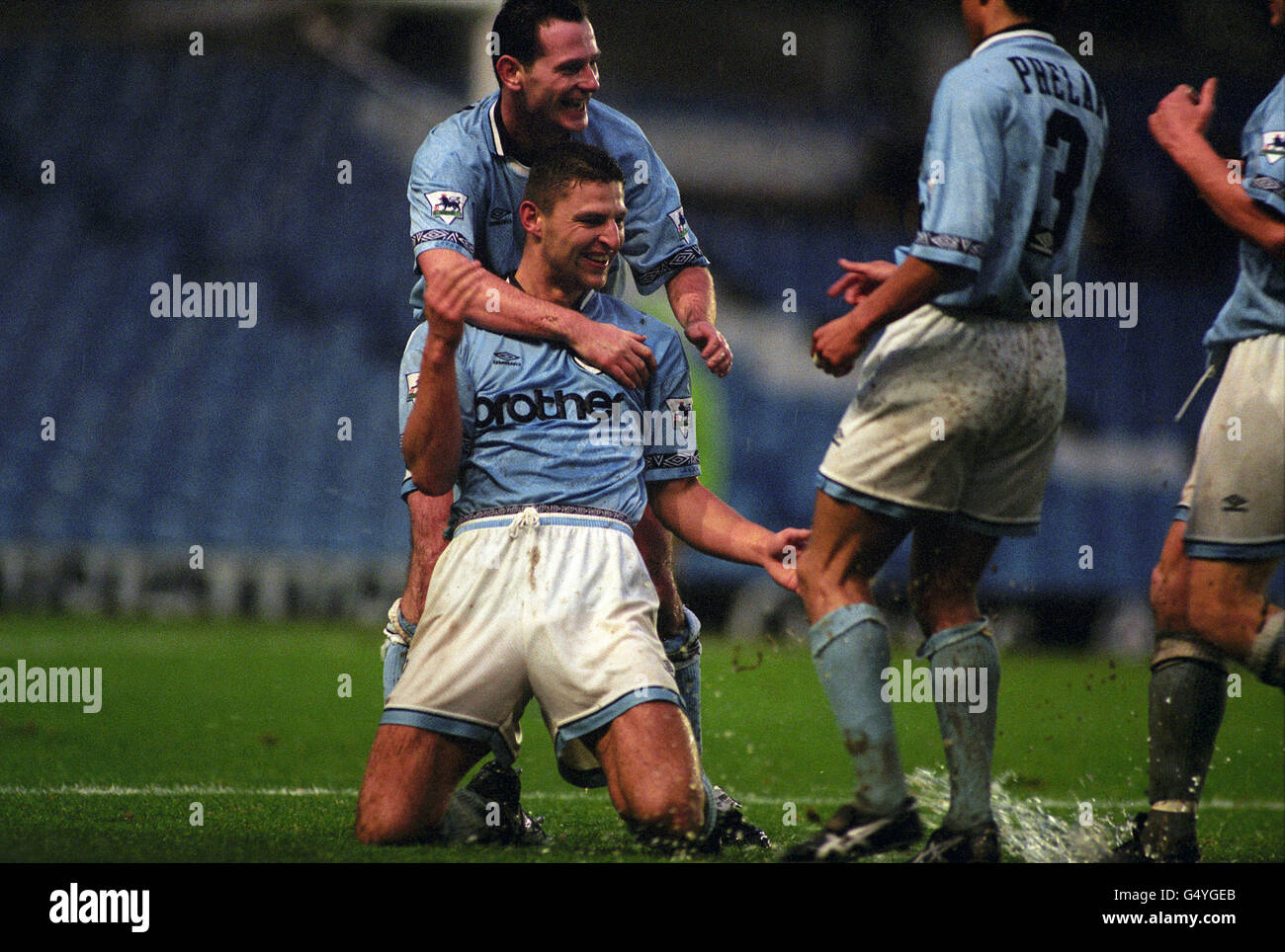 Manchester City's Michel Vonk (kneeling) celebrates scoring against ...