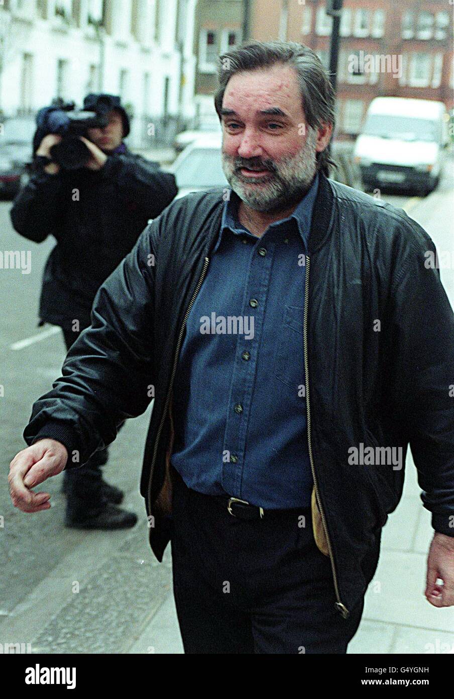 Soccer legend george best emerges from his london flat hi-res stock ...