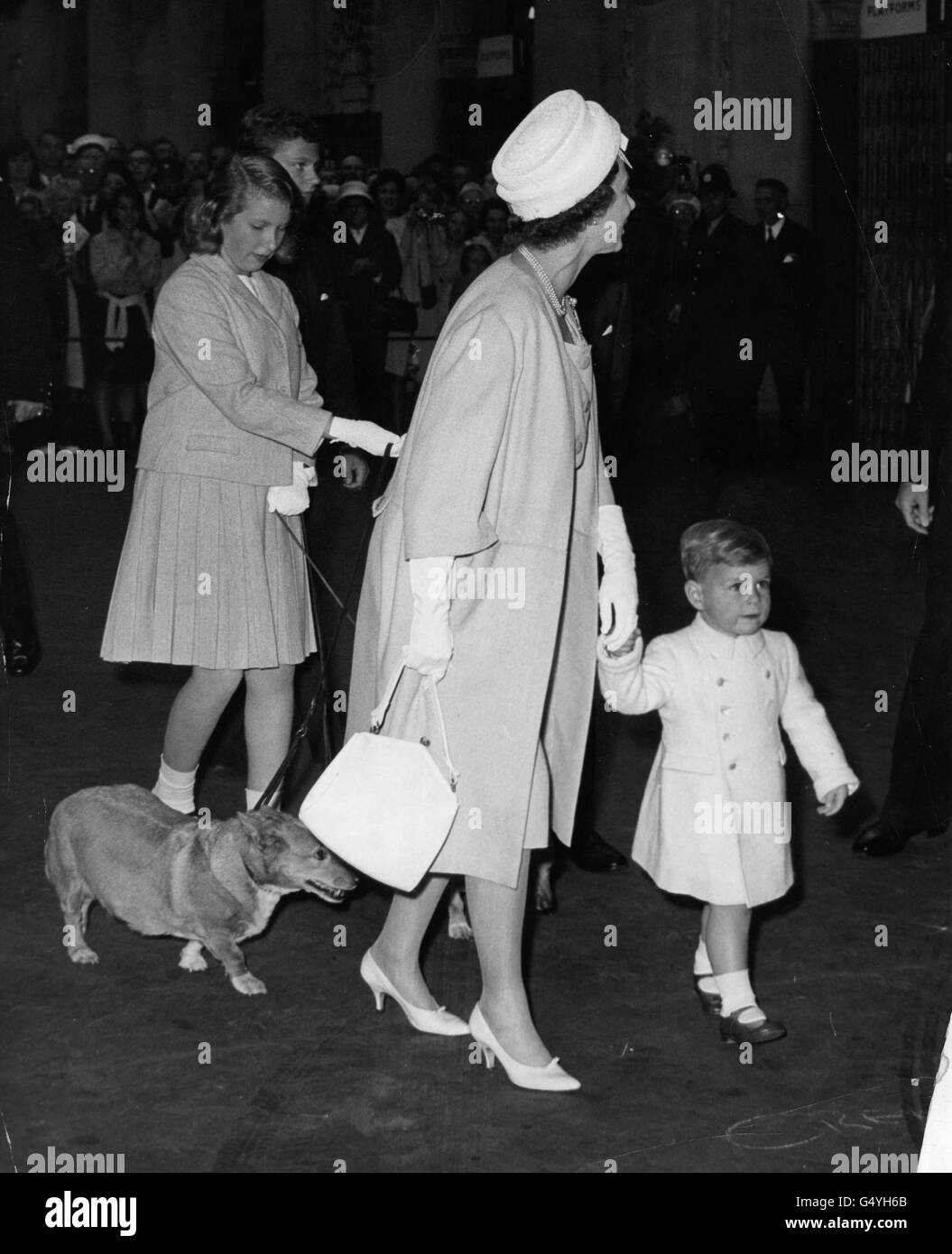 Scanned low res print queen elizabeth ii holding hand son Black and ...