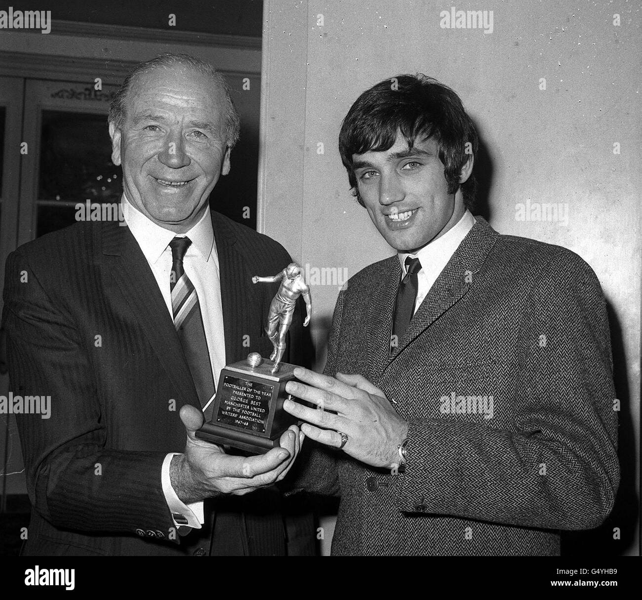 Manchester United forward George Best shows his silver statuette as ...