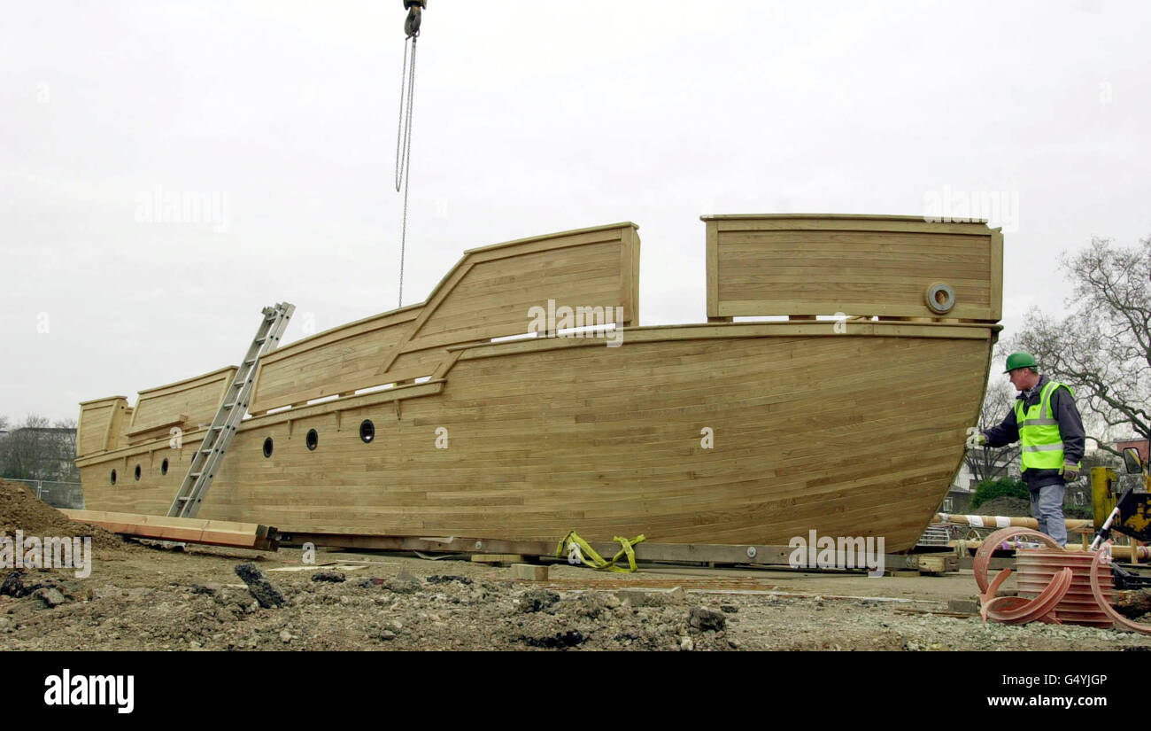 Workmen begin construction on a wooden ship as part of the 1.3 million ...