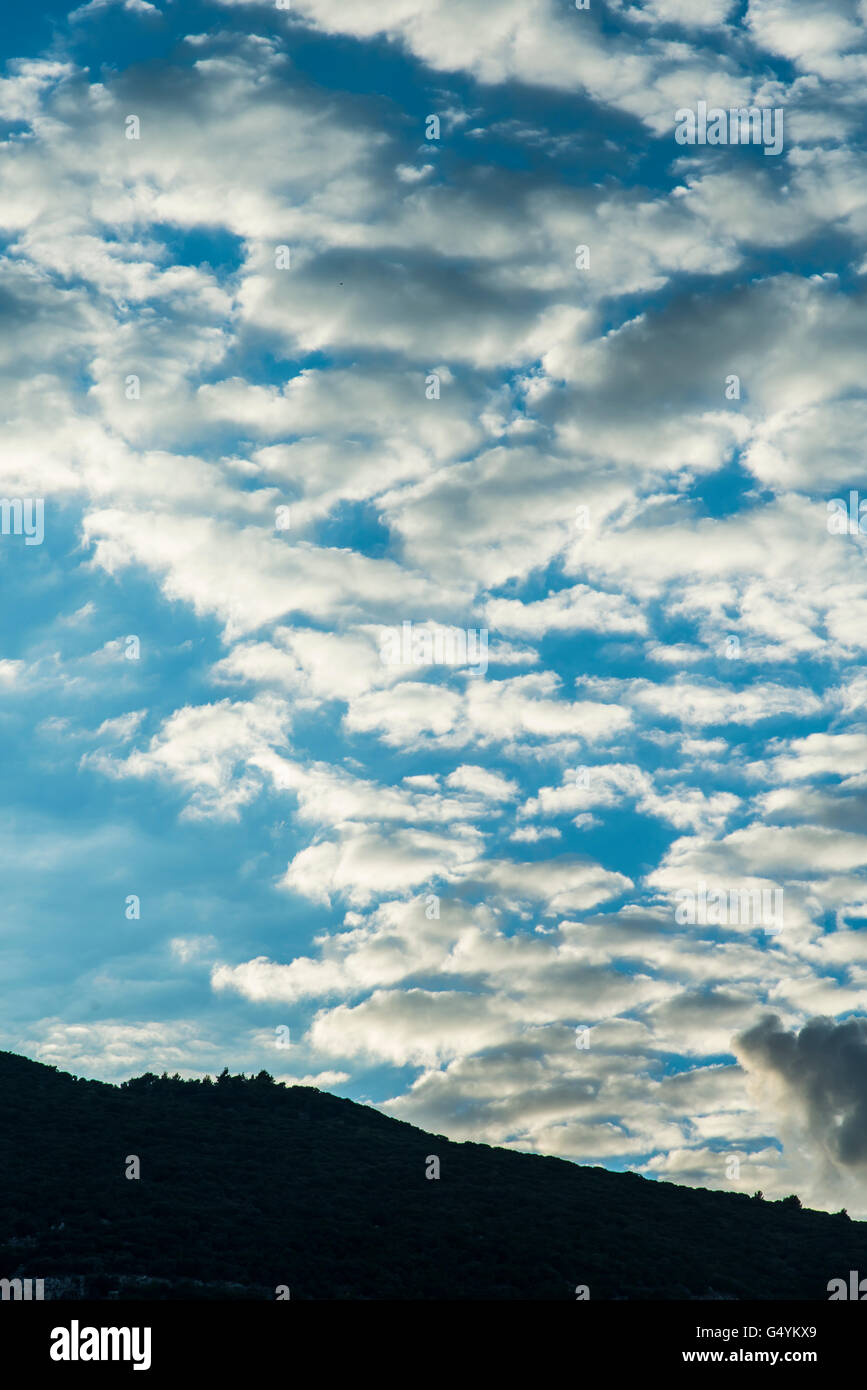 Heavy clouded skies over a steep slope Stock Photo - Alamy
