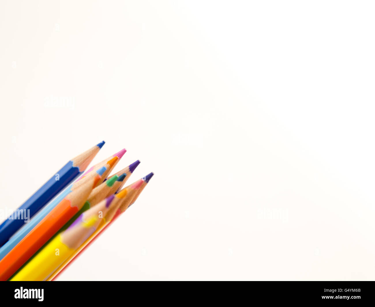 Colorful group of pencil crayons on a white background Stock Photo - Alamy