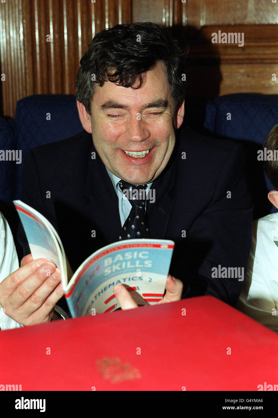 Gordon Brown flicks through a mathematics textbook while receiving ...