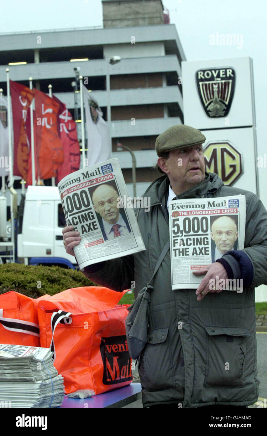 A newspaper vendor holds aloft the morning paper outside the Rover ...