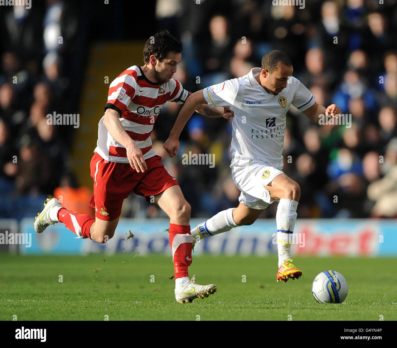 Leeds United's Andros Towsend (right) and Doncaster Rovers' Brian Stock ...