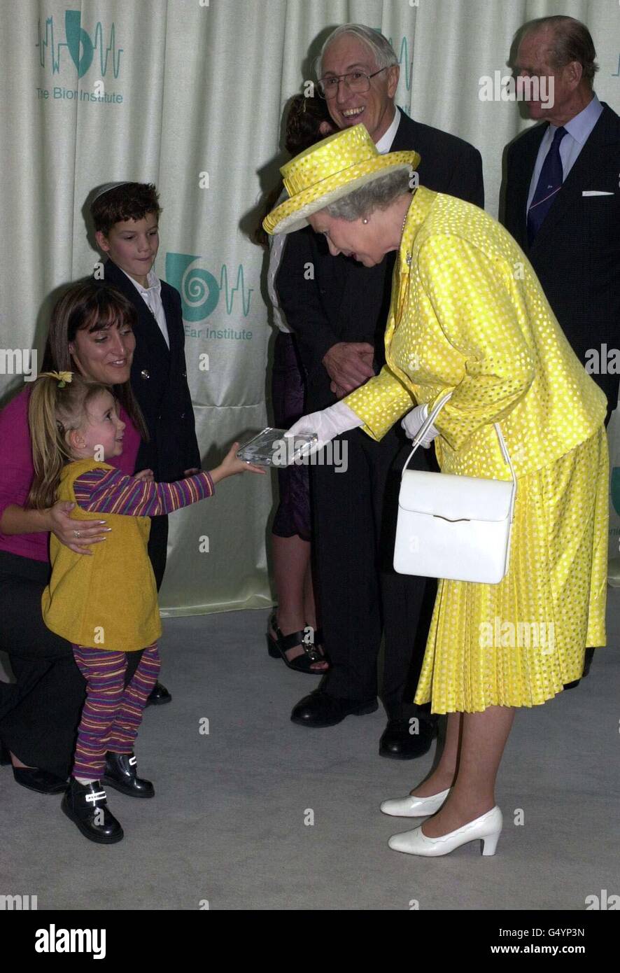 The Queen Receives a bionic ear in perspex from Claudia Danese at the ...