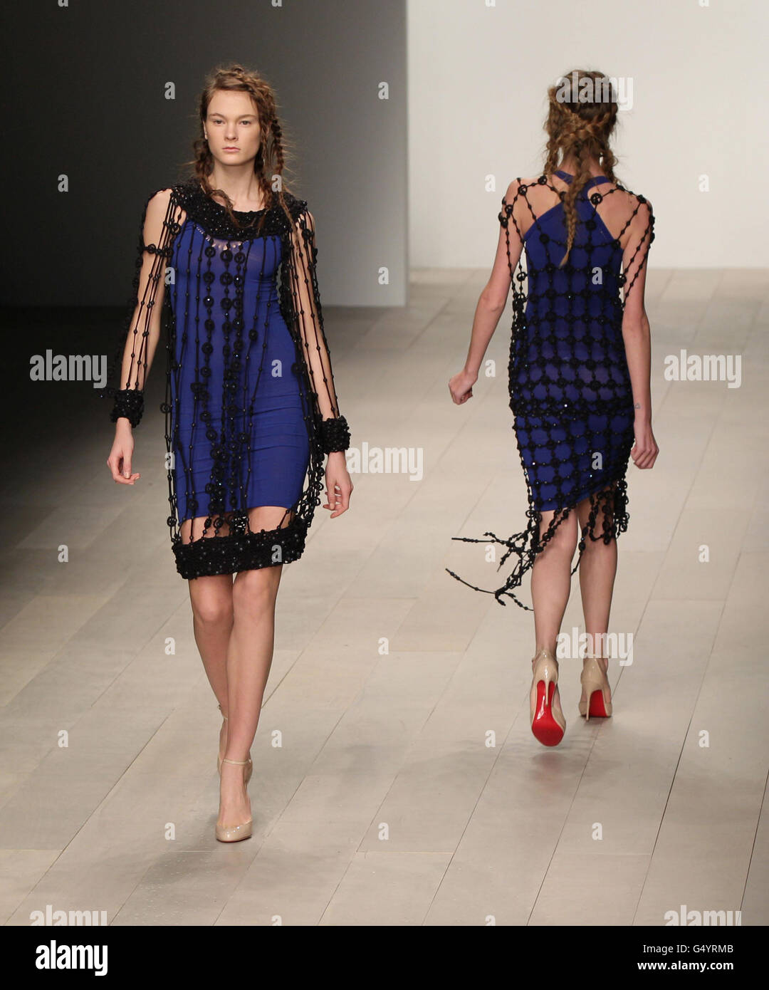 Models on catwalk mark fast fashion show in courtyard space hi-res ...