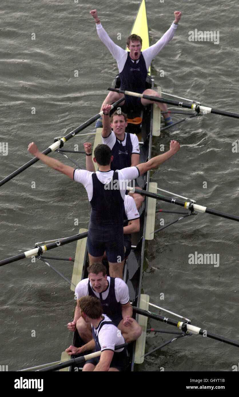 Oxford's rowers celebrate as their boat passes under Chiswick Bridge to ...