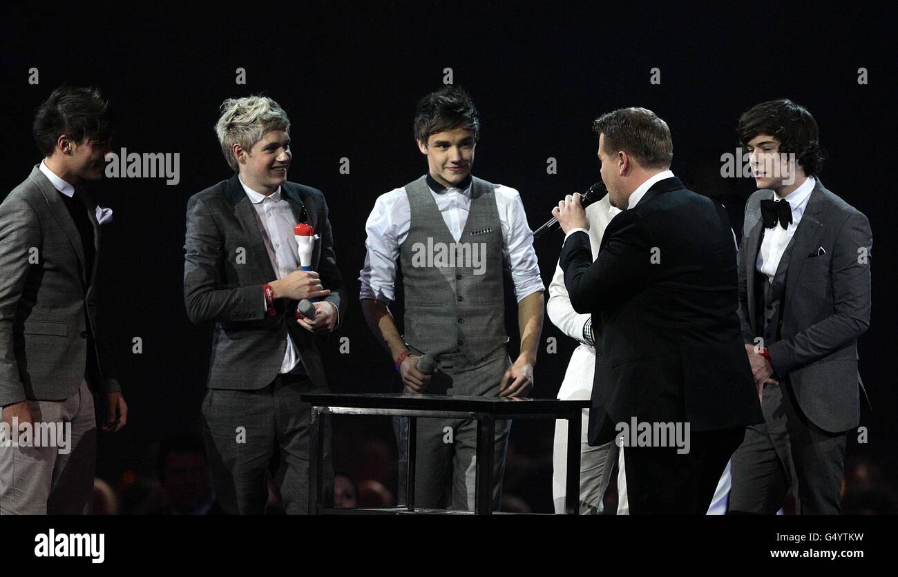 One Direction collect the British Single award on stage with James ...