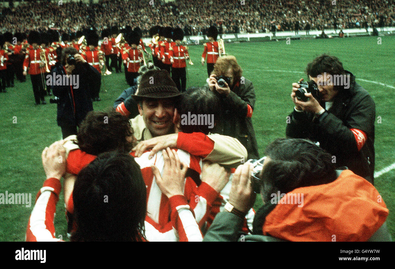 Sunderland's Manager Bob Stokoe hugs his players after their FA Cup ...