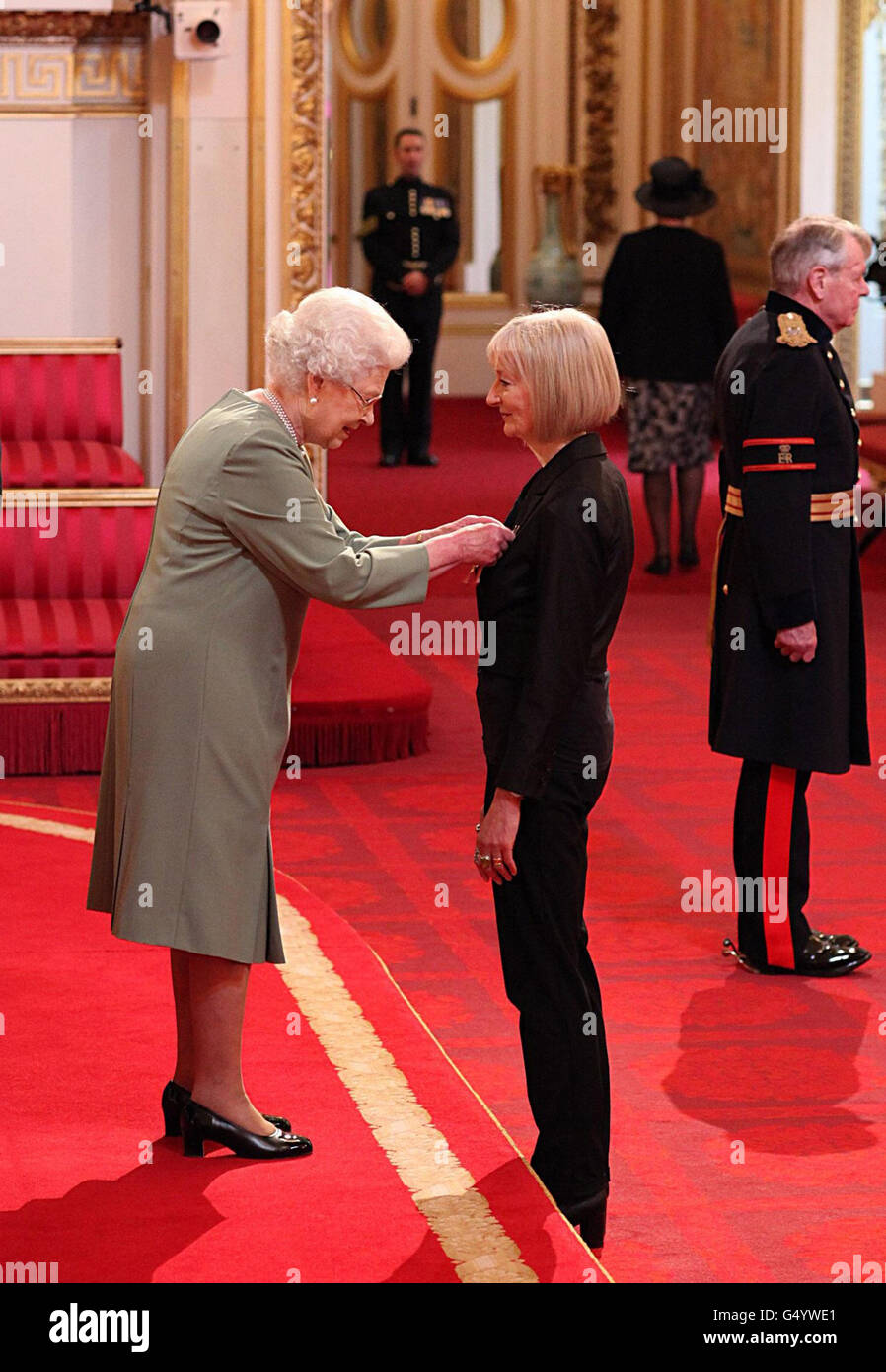Officer british empire obe medal investiture ceremony in buckingham ...