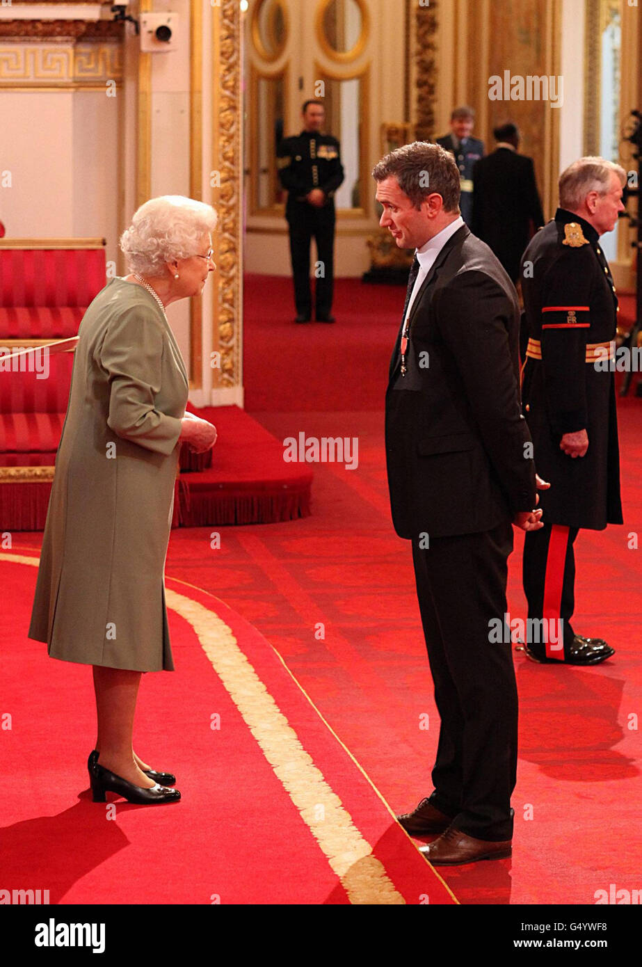 Queen Elizabeth II presents James Peacock with his Member of the ...