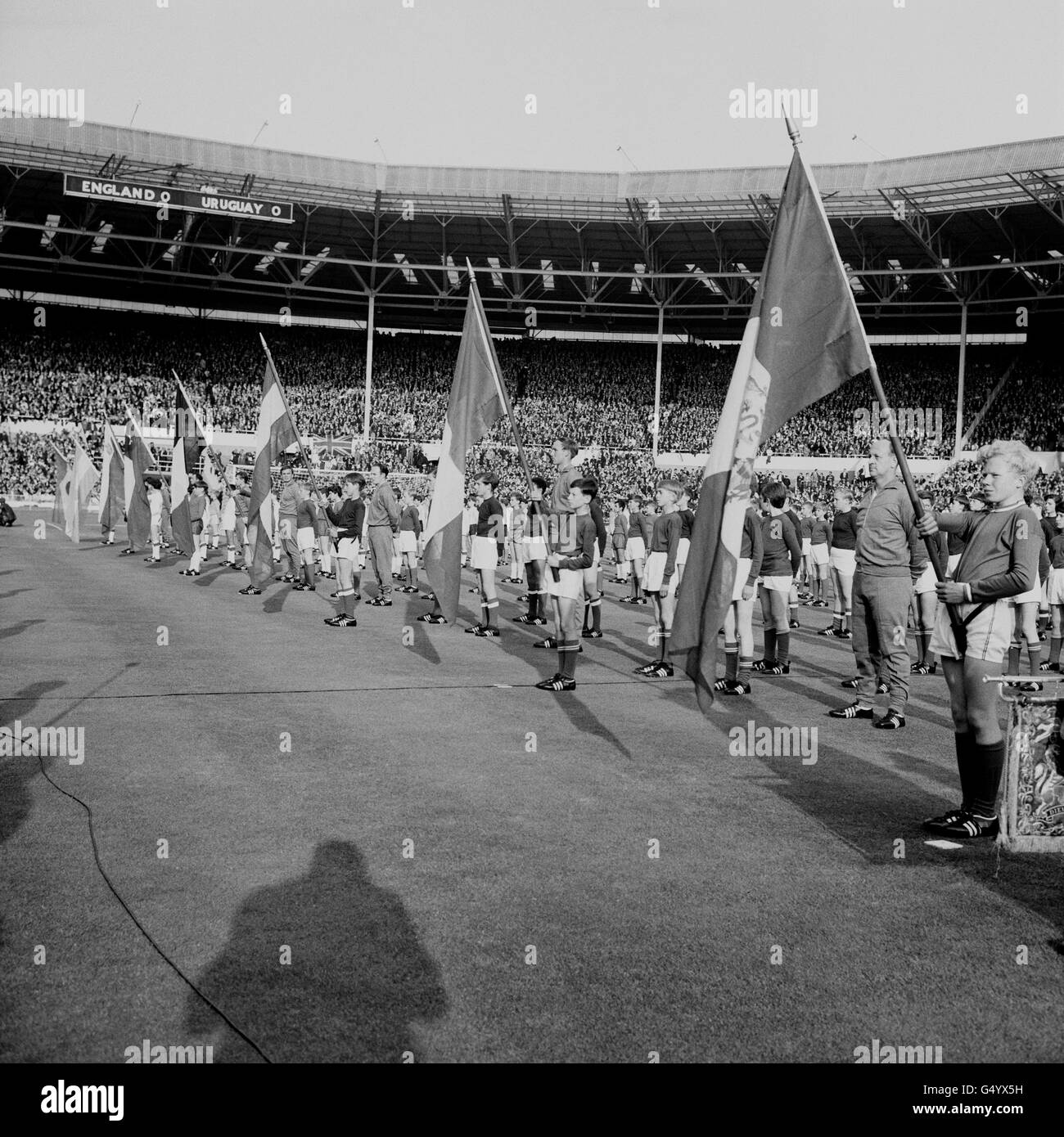 Parade of the flags of competing nations on the field at Wembley ...