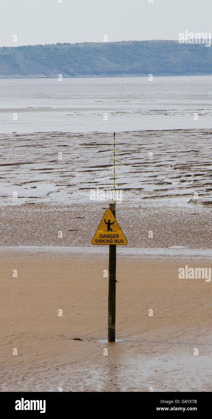 Sinking mud warning sign on beach Stock Photo - Alamy