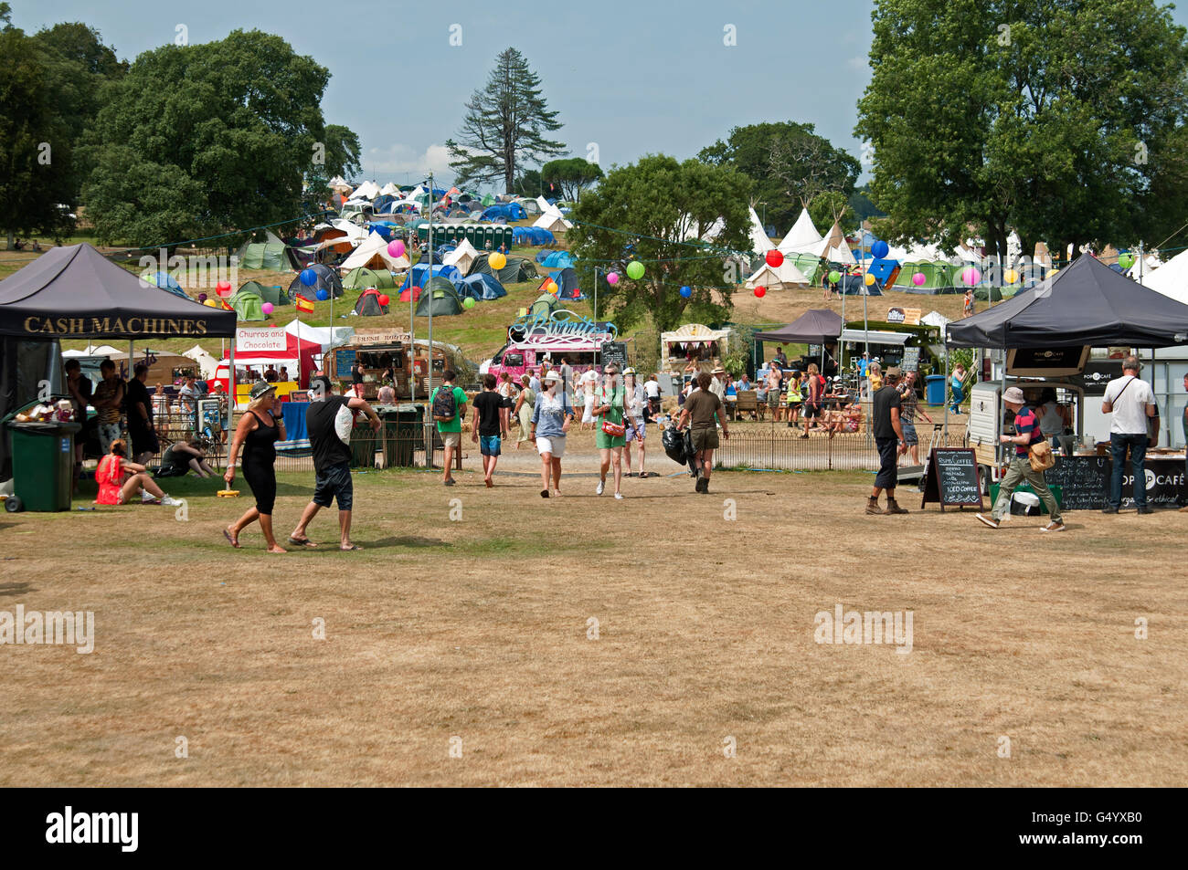 Families walking around the grounds in front of entertainment tents at ...