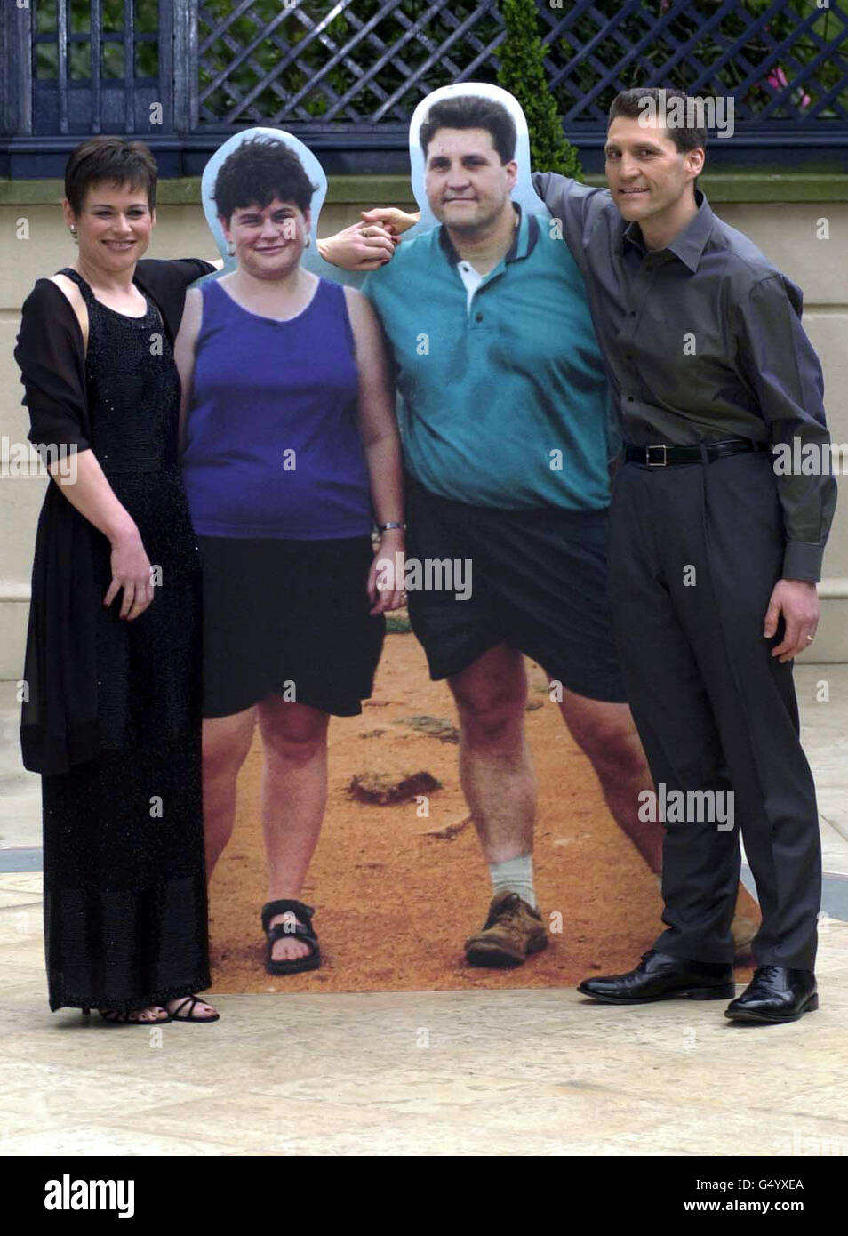 Sally and Nicholas Buckel pose with cardboard cut-outs of themselves at ...