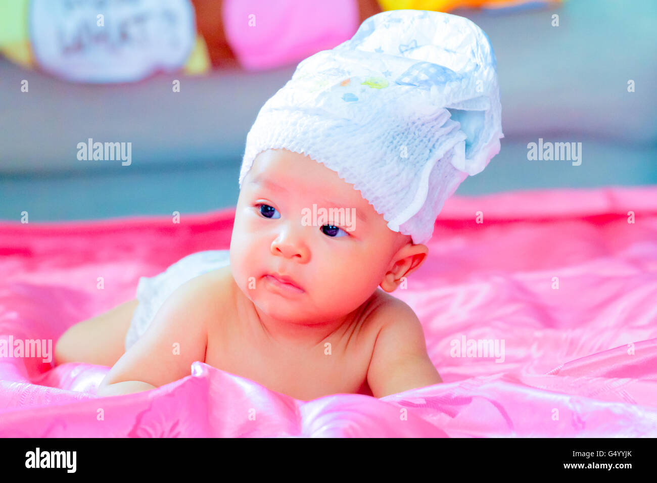 adorable little boy with pamper on head,little boy in bedroom. Newborn ...
