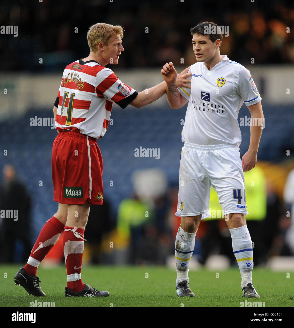 Leeds United's Darren O'Dea (right) confronts Doncaster Rovers' Adam ...