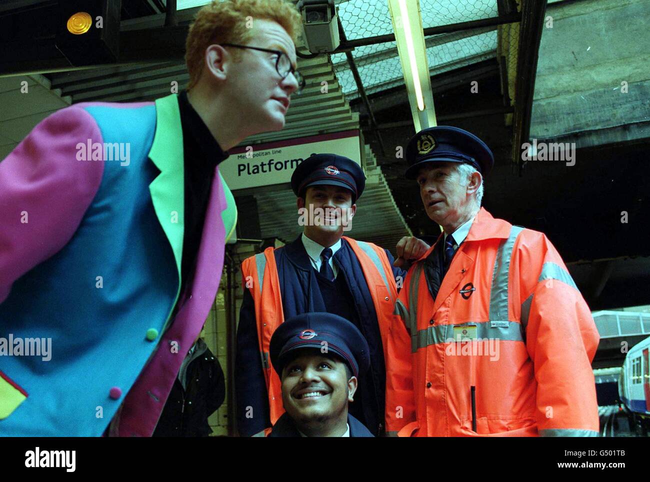 Tube staff share a joke as they look at a waxwork of TV and radio ...