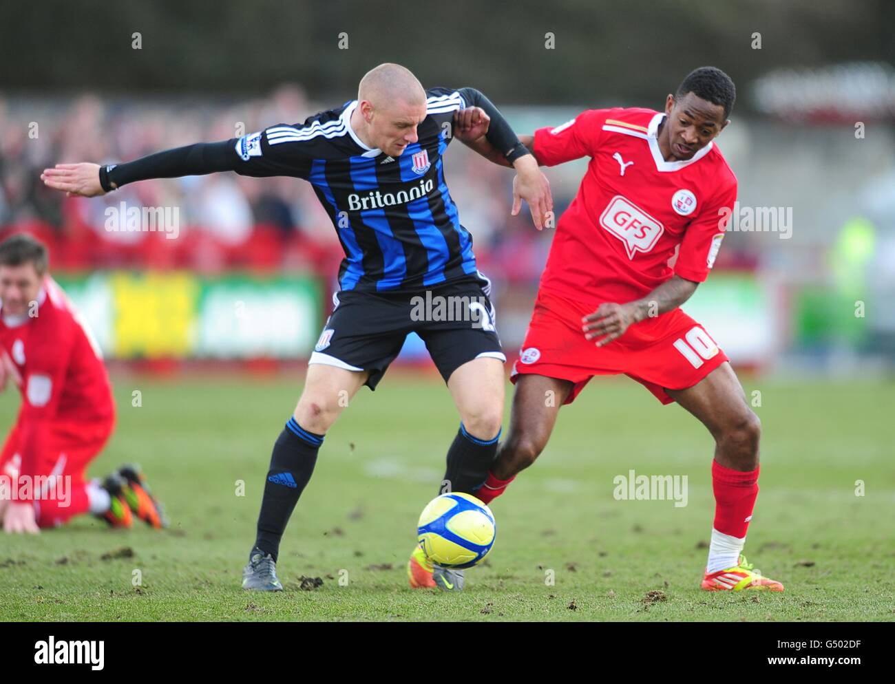 Stoke City's Andy Wilkinson (left) and Crawley Town's Sanchez Watt ...