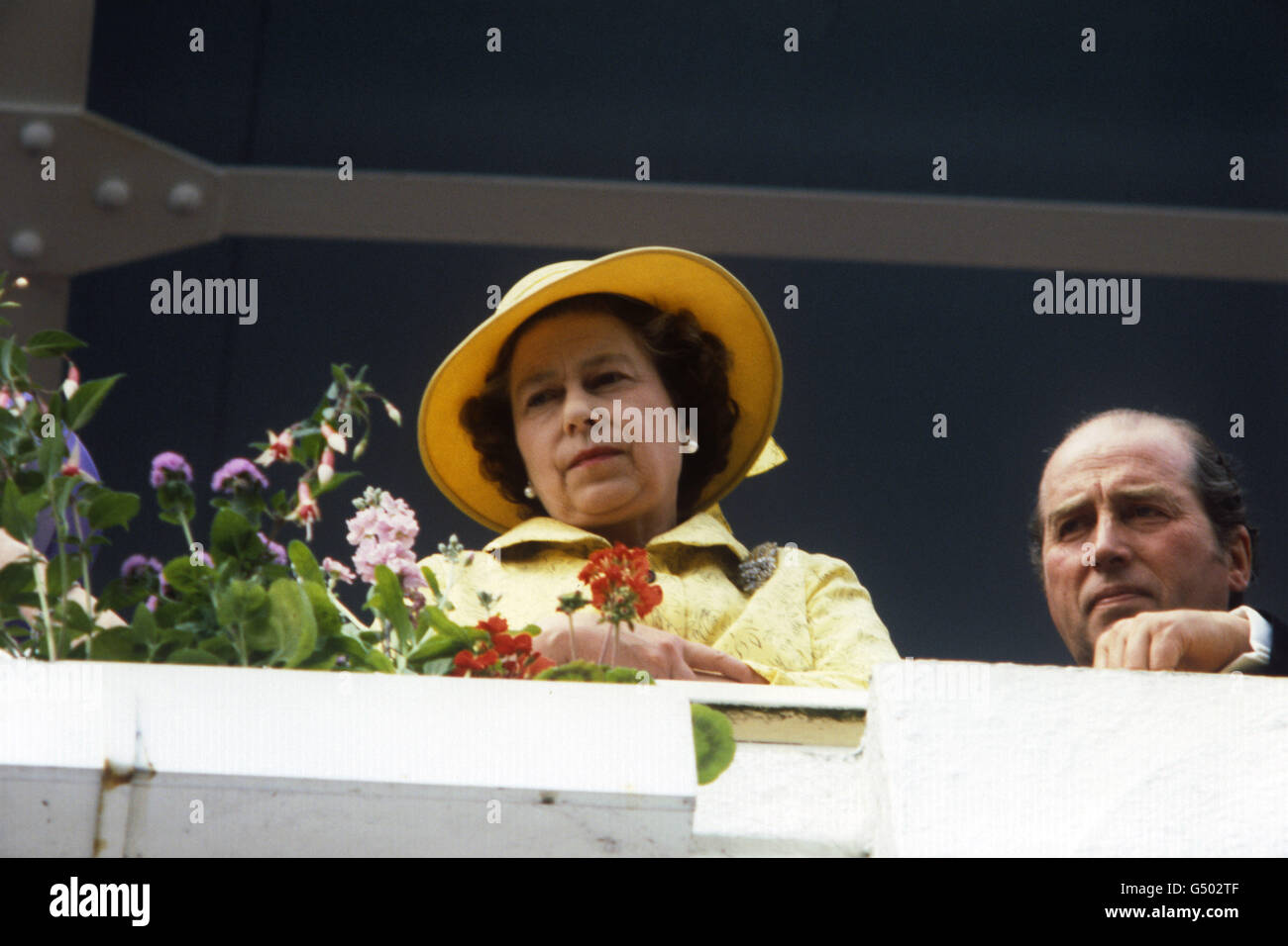 The Queen looking down over the flowers from the Royal Box as she ...